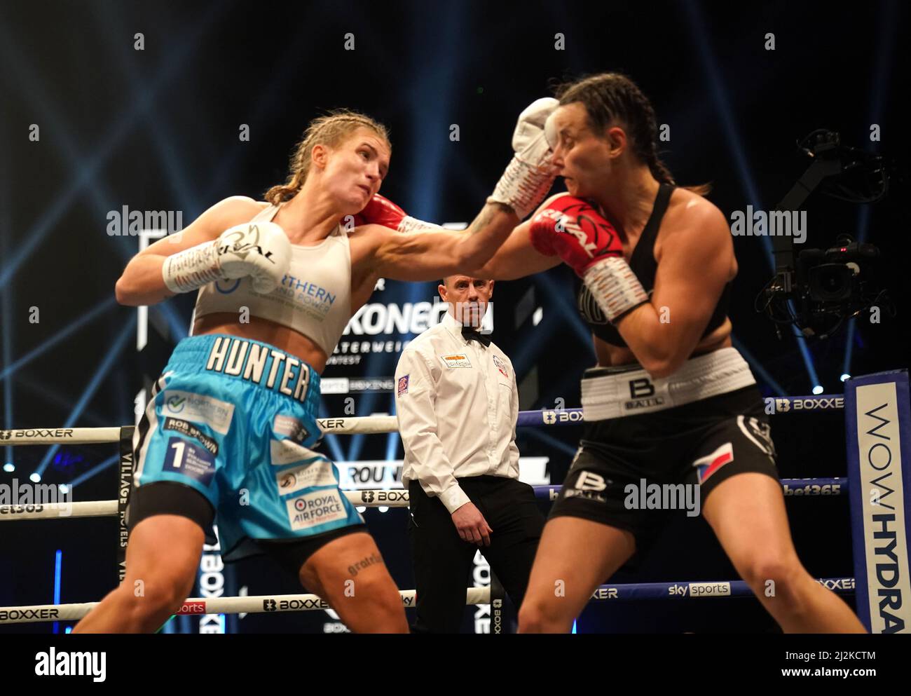 April Hunter (left) and Ester Koneca in the super welter weight bout at ...
