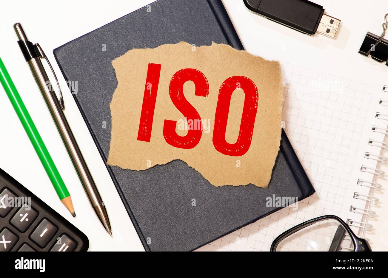 ISO 9001 written on paper ripped and torn edges Stock Photo - Alamy