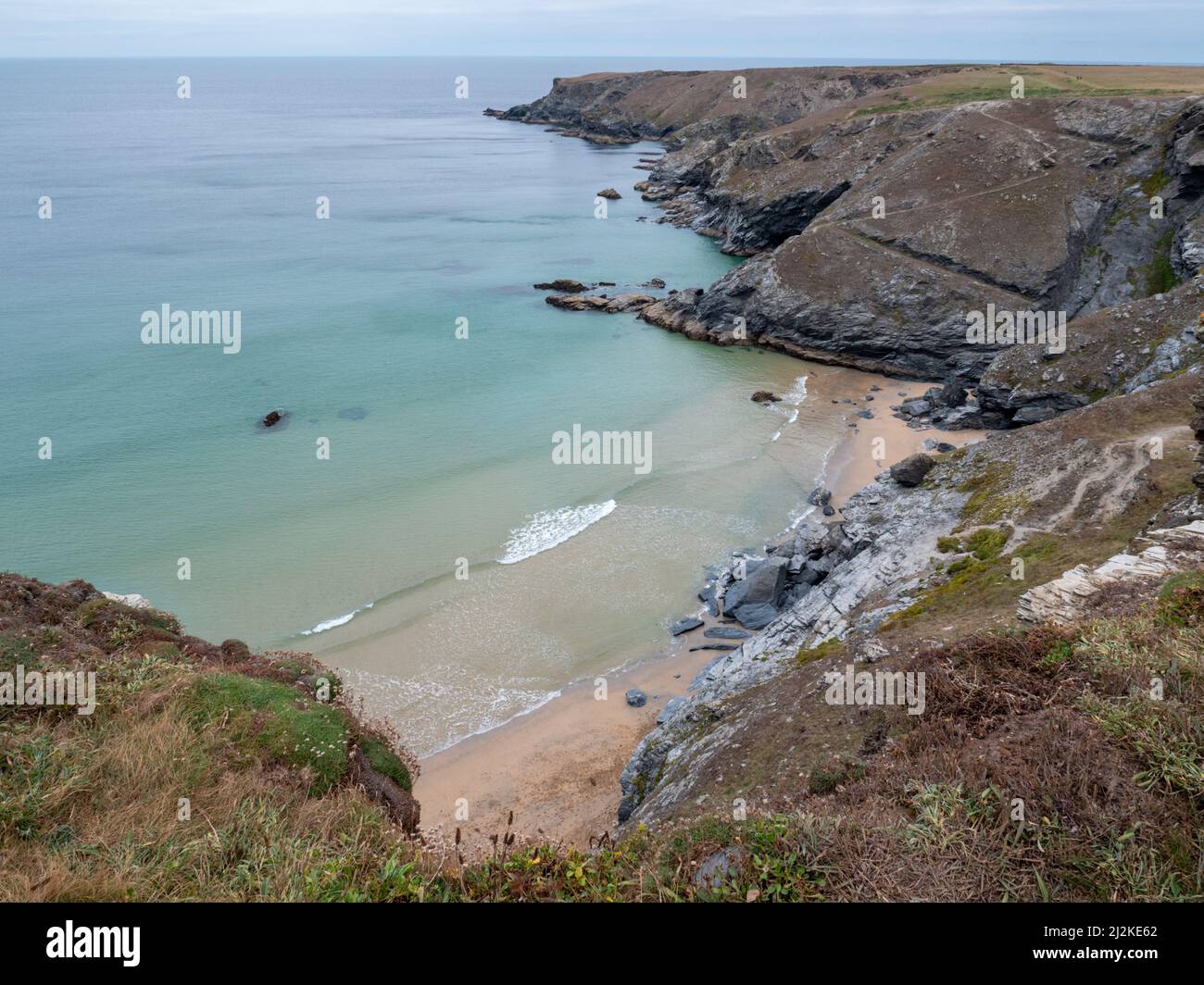 The cliffs and rocky shore and a secluded beach on the north Cornwall ...