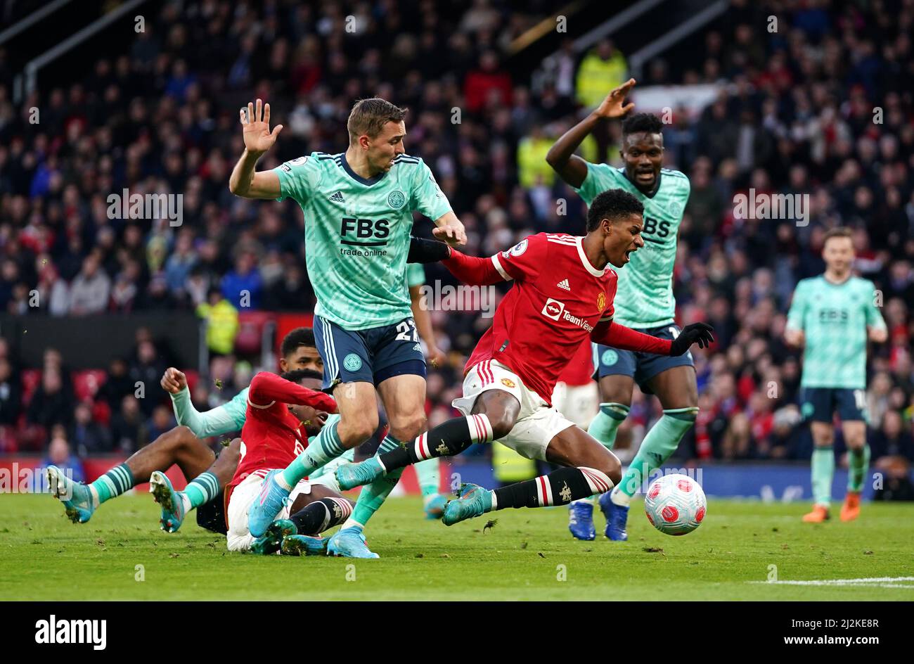 Manchester United's Marcus Rashford (centre right) trips in the penalty ...
