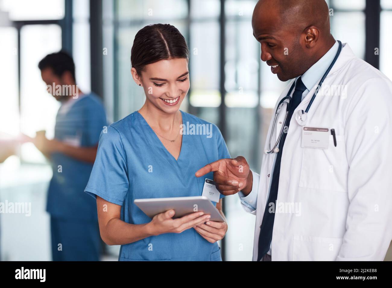 You have an appointment at three oclock today. Shot of two cheerful ...
