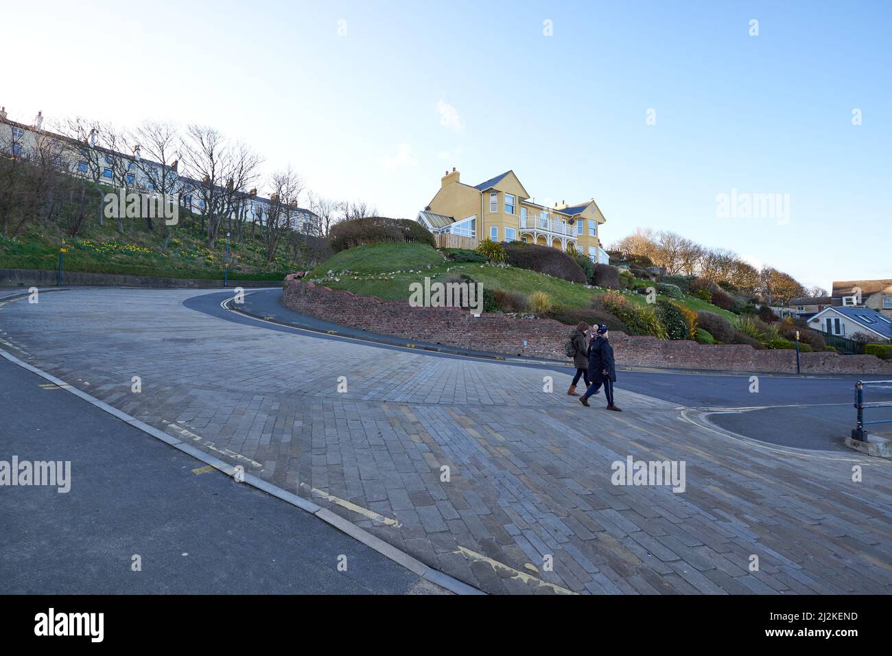 Home on a hill by a curved road in Filey, Yorkshire, UK Stock Photo - Alamy