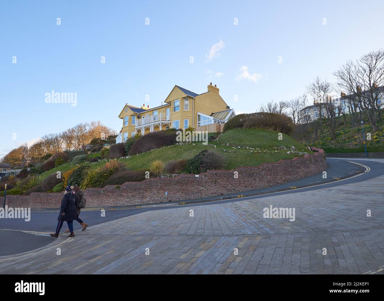 Home on a hill by a curved road in Filey, Yorkshire, UK Stock Photo - Alamy
