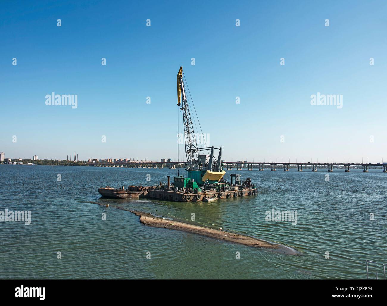 Cleaning the newly formed island from industrial waste on the Dnieper ...