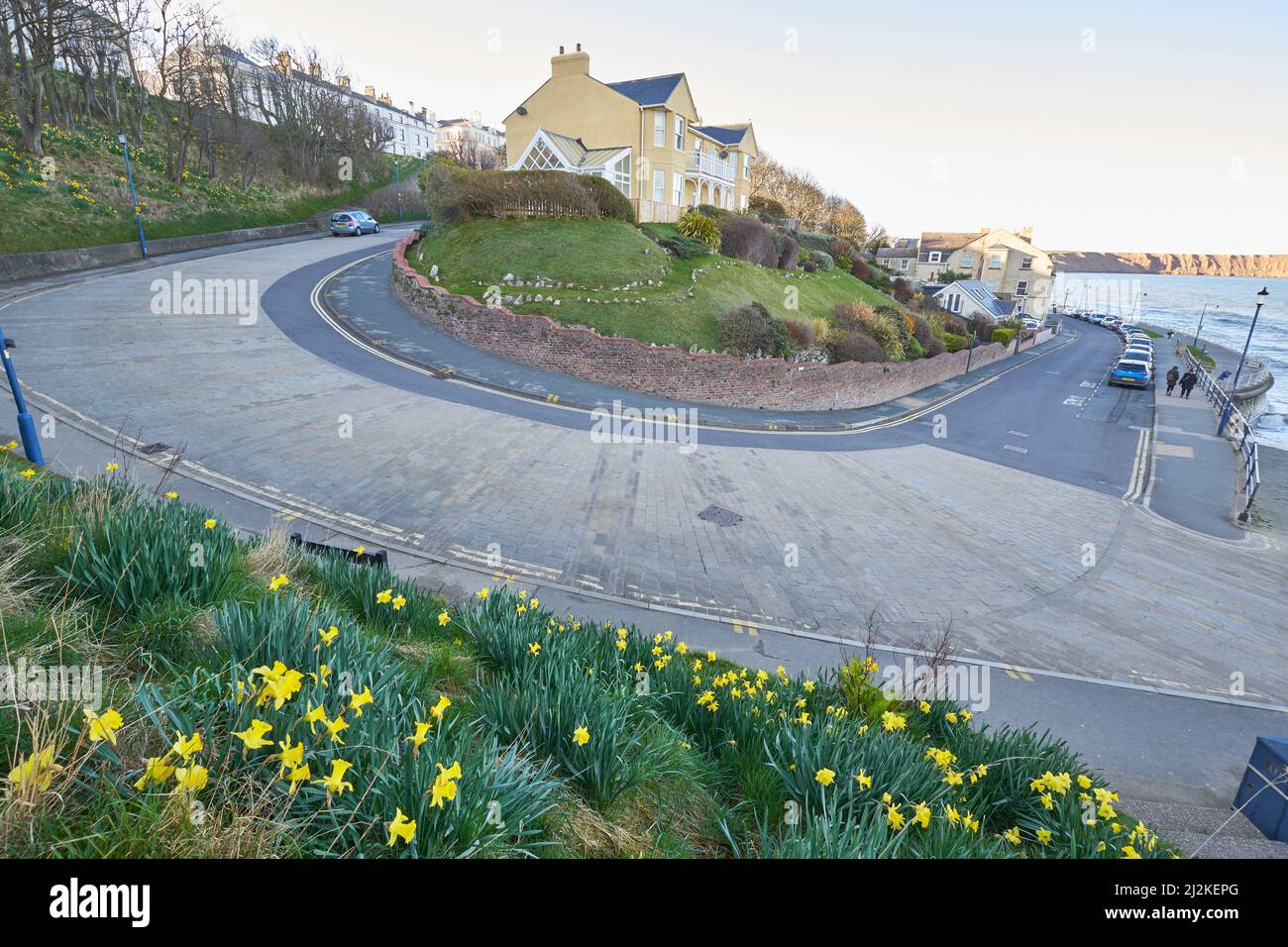 Home on a hill by a curved road in Filey, Yorkshire, UK Stock Photo - Alamy