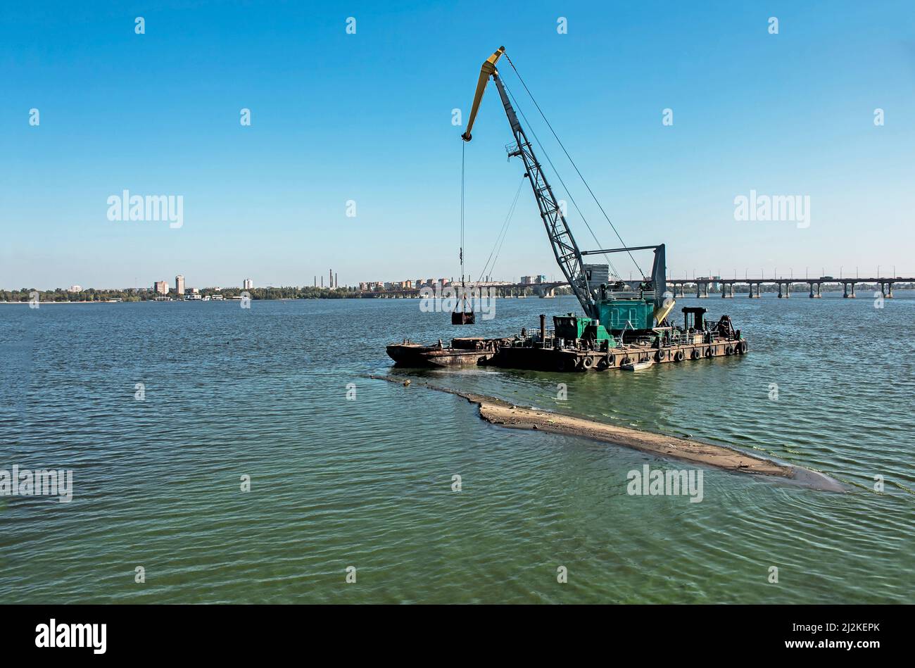 Cleaning the newly formed island from industrial waste on the Dnieper ...