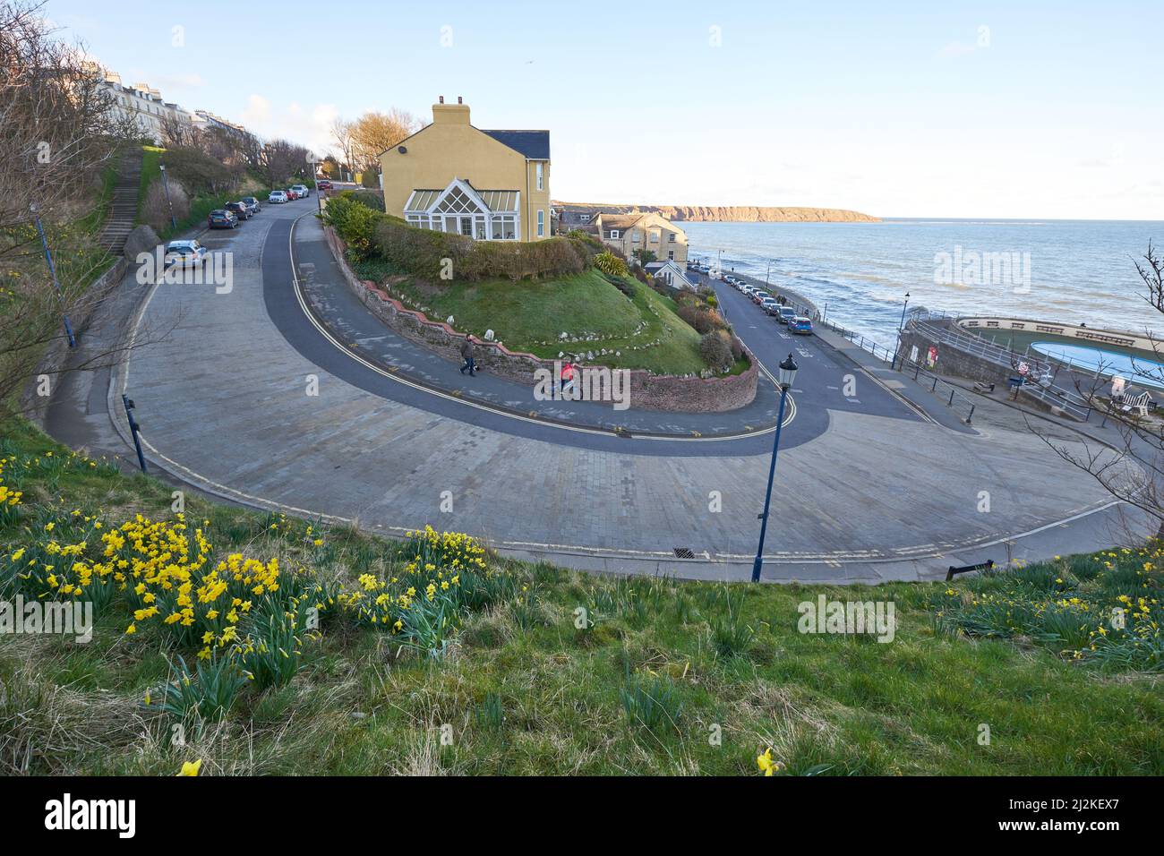 Home on a hill by a curved road in Filey, Yorkshire, UK Stock Photo - Alamy