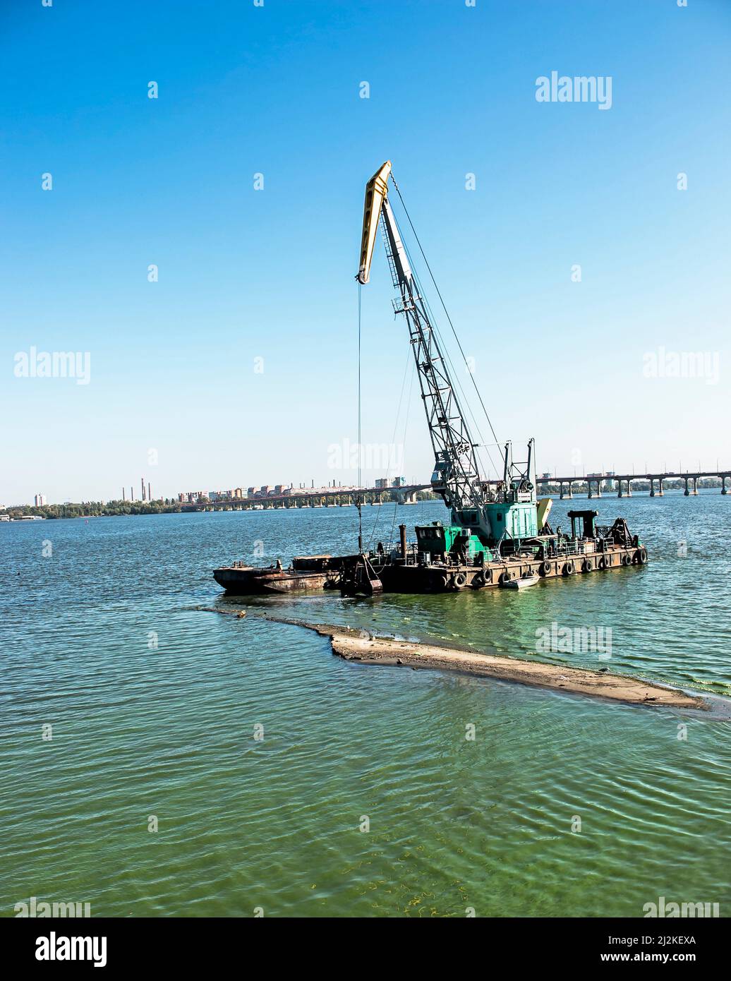 Cleaning the newly formed island from industrial waste on the Dnieper ...