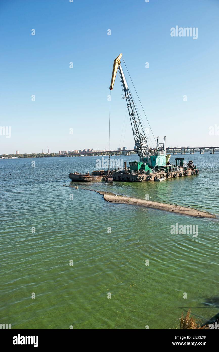 Cleaning the newly formed island from industrial waste on the Dnieper ...