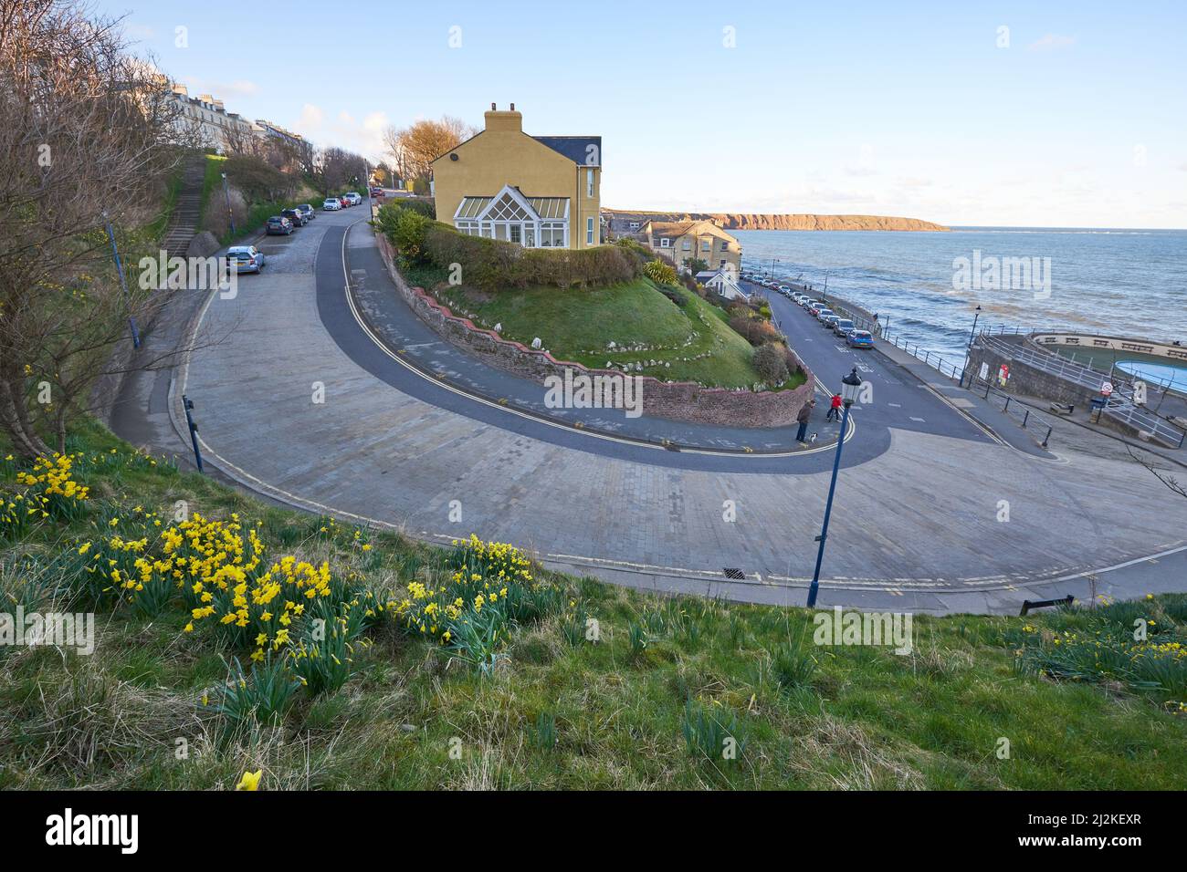 Home on a hill by a curved road in Filey, Yorkshire, UK Stock Photo - Alamy