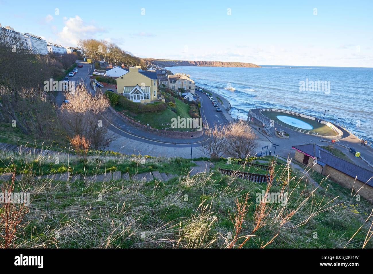 Home on a hill by a curved road in Filey, Yorkshire, UK Stock Photo - Alamy