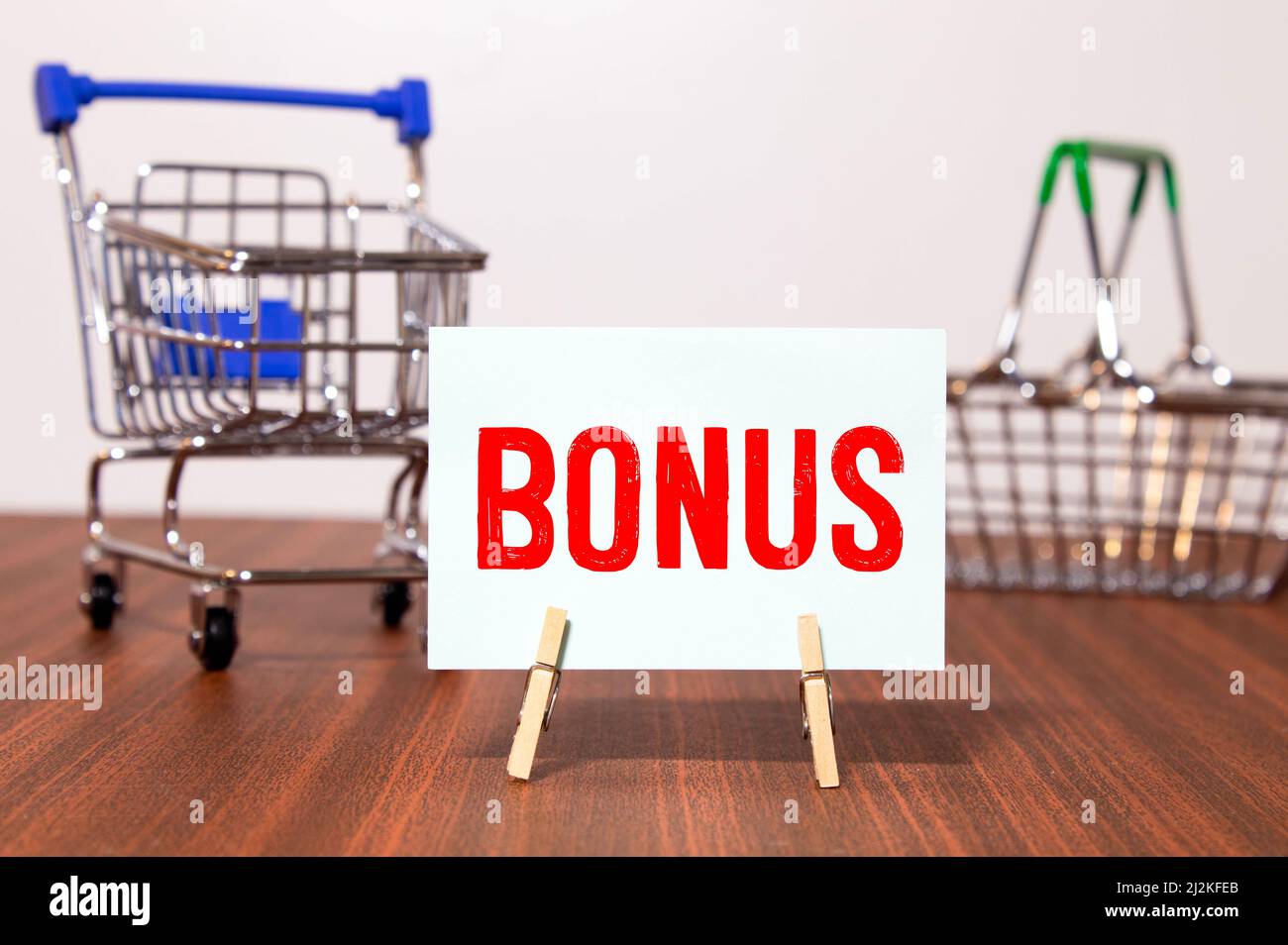 The word BONUS is written in red on a white and black background near ...