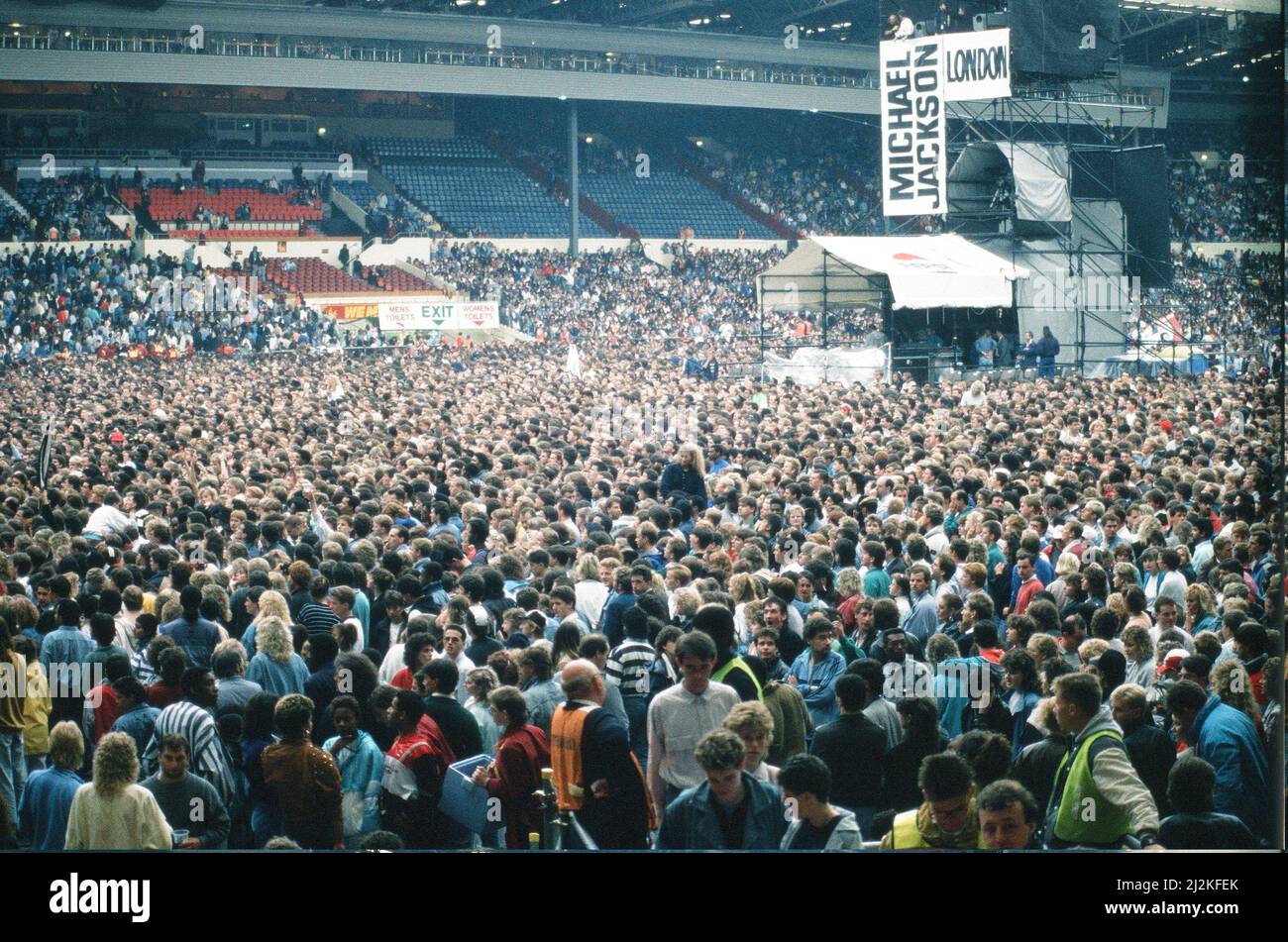 Audience gather outside the Wembley arena prior to the Michael Jackson ...