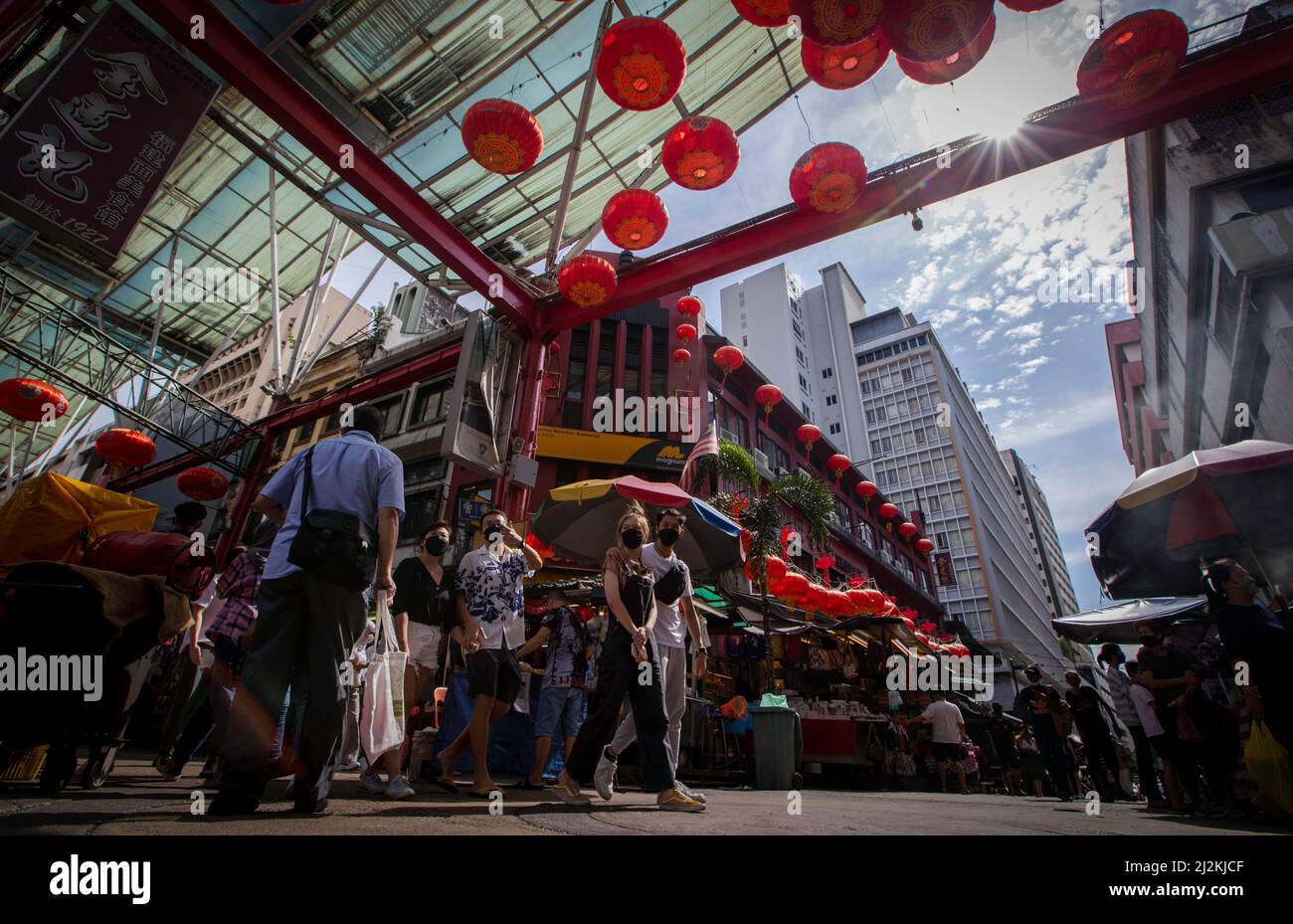 People are seen walking along the China Town district. Malaysia reopens ...