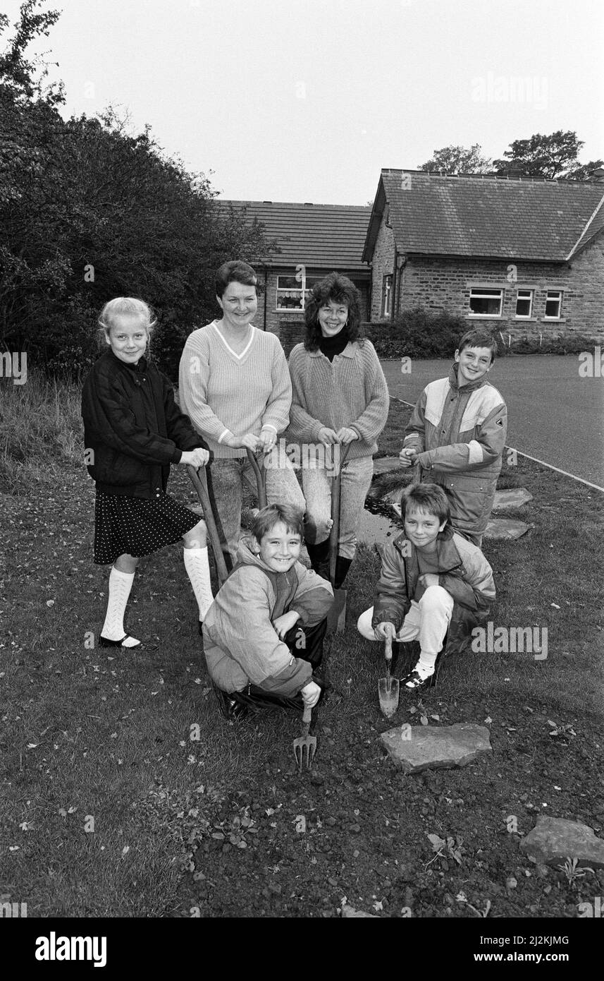 Digging in... Parents and pupils at Flockton CofE First School are seen ...