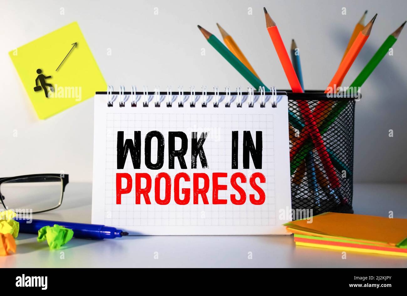 Work in Progress text written on a notebook with pencils Stock Photo ...