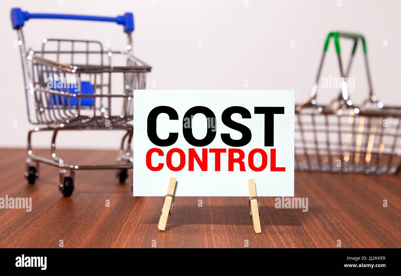white paper on the white background with text Cost Control Stock Photo ...
