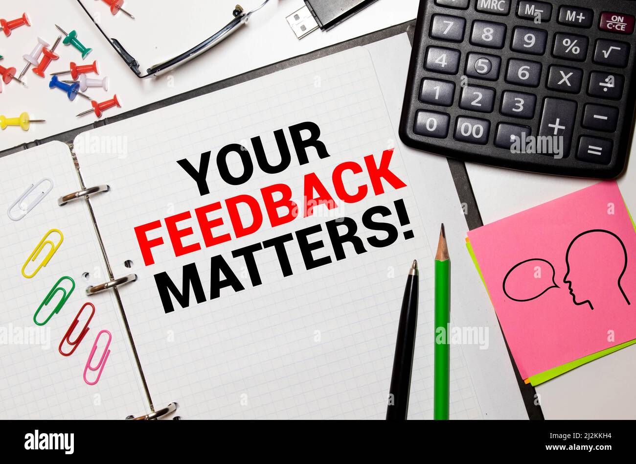 Text your feedback matters on white paper background, business concept ...