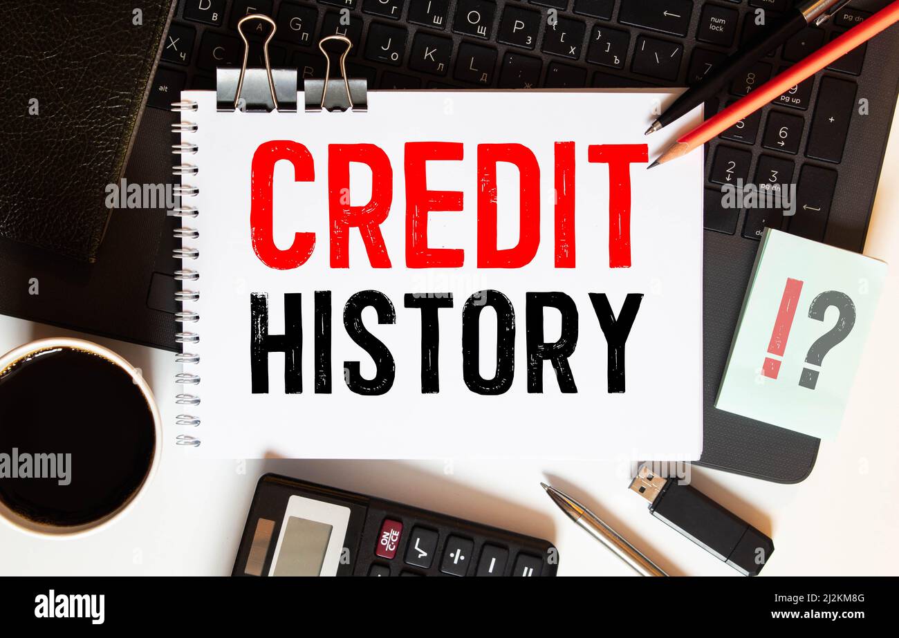 Work smarter text Credit History on white sheet with pen, calculator ...