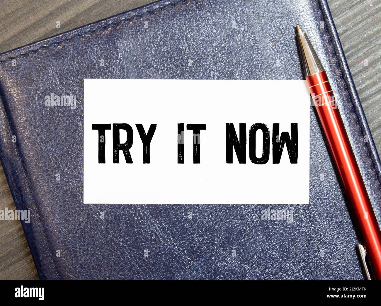 try it now text write on paper, concept Stock Photo - Alamy