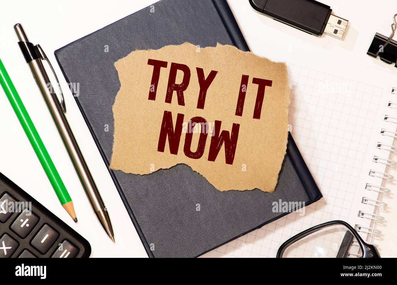 try it now text write on torn paper Stock Photo - Alamy