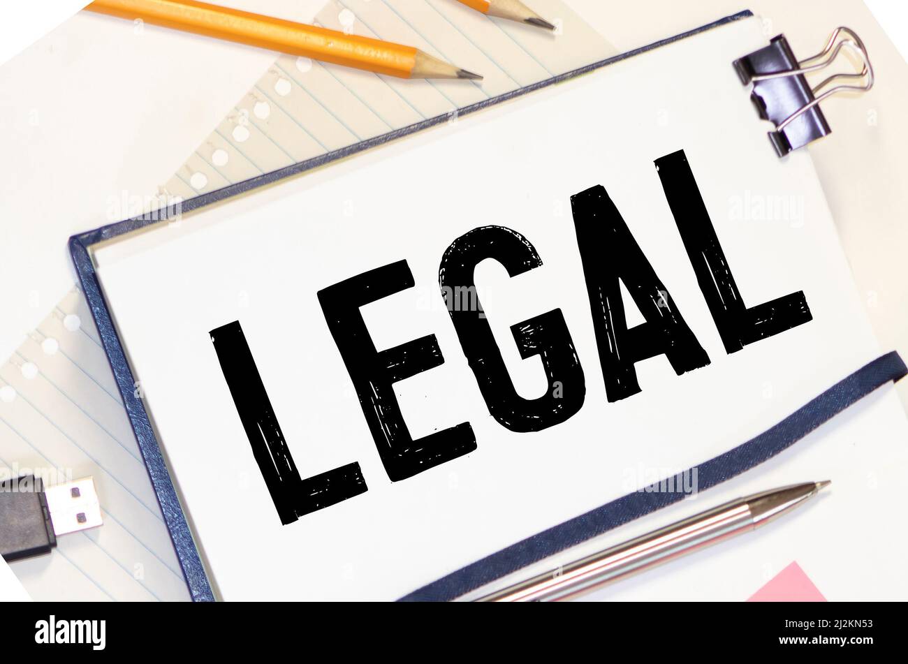 Business concept. Notebook with text LEGAL sheet of white paper for ...