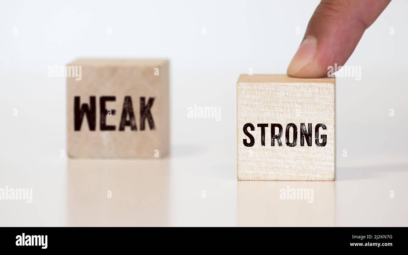 Strong versus Weak text on notebook with many light bulbs Stock Photo ...
