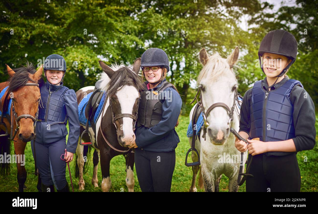 All great days are spent with a horse. Shot of a group of teenage girls ...