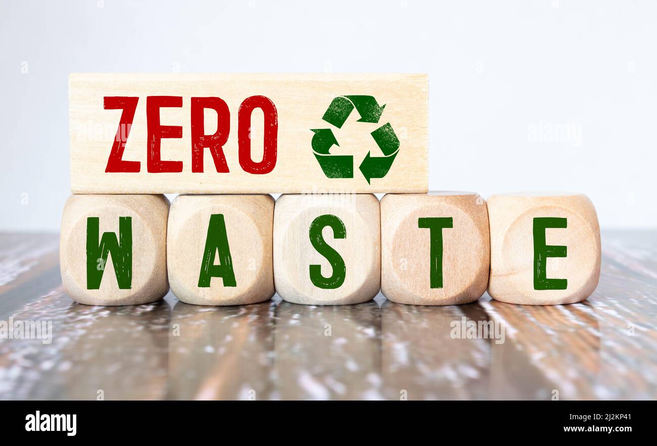 zero waste wooden block text with figure man on white background Stock ...