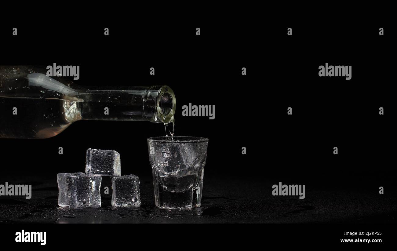 Hand pours vodka tequila sake hi-res stock photography and images - Alamy