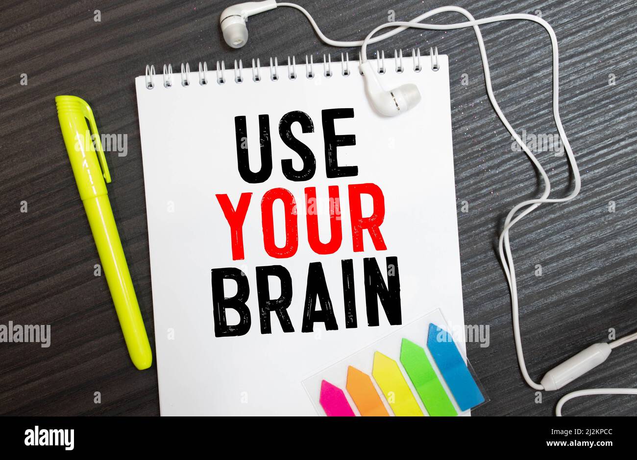 The phrase Use Your Brain in blue text on an index card pinned to a ...