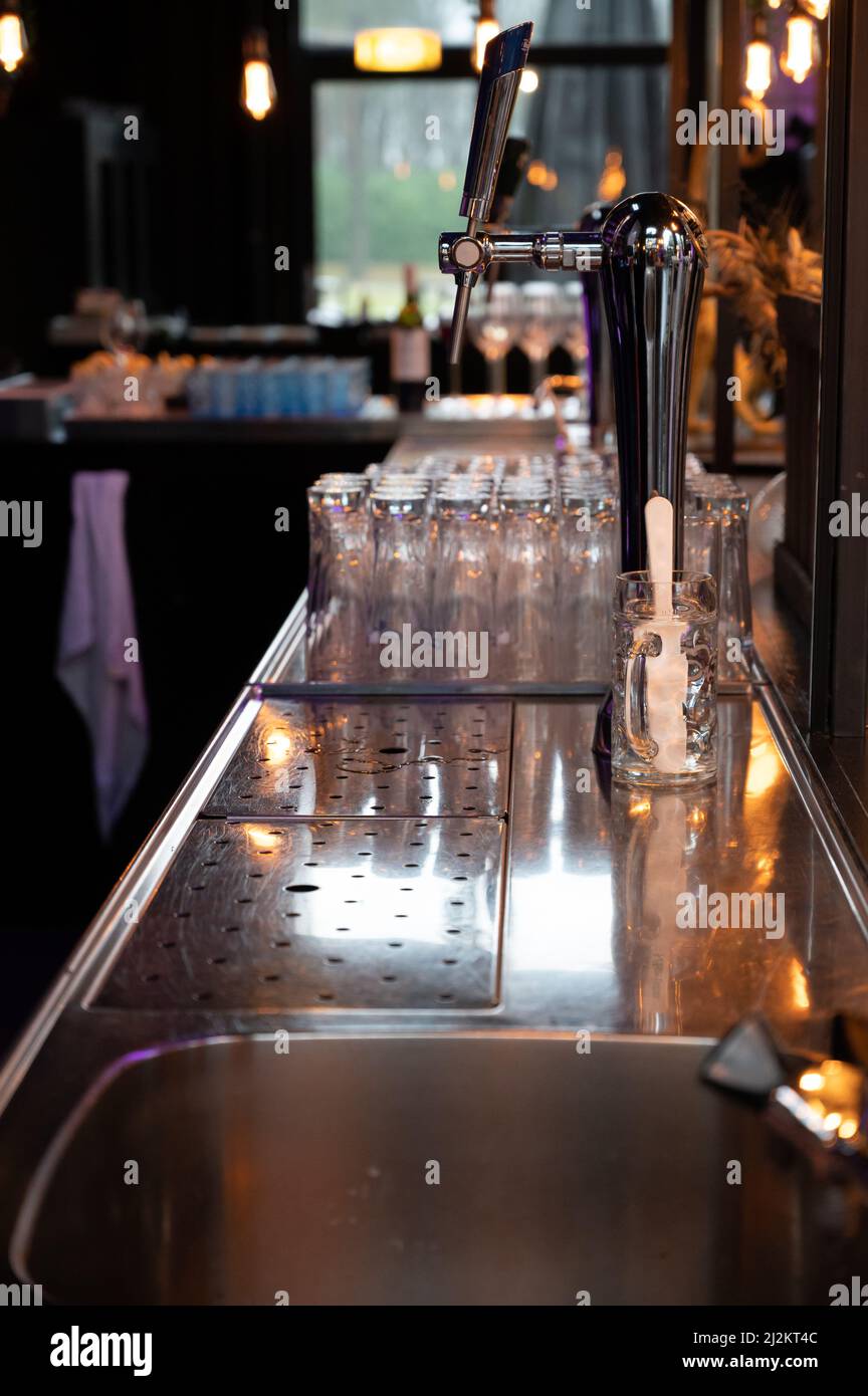 Interior of classic beer and whisky bar with beer taps and empty ...