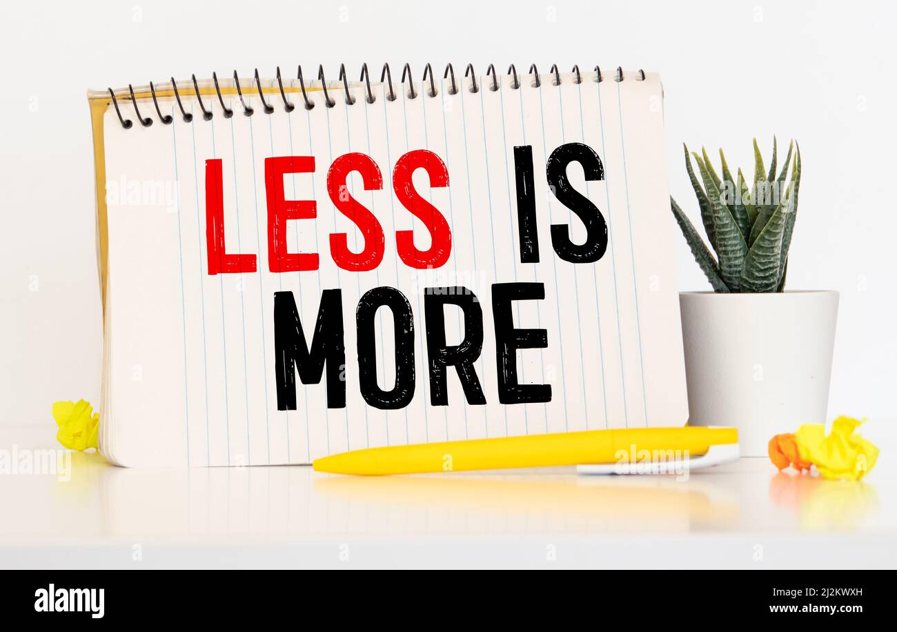 Text less is more on the short note texture background Stock Photo - Alamy