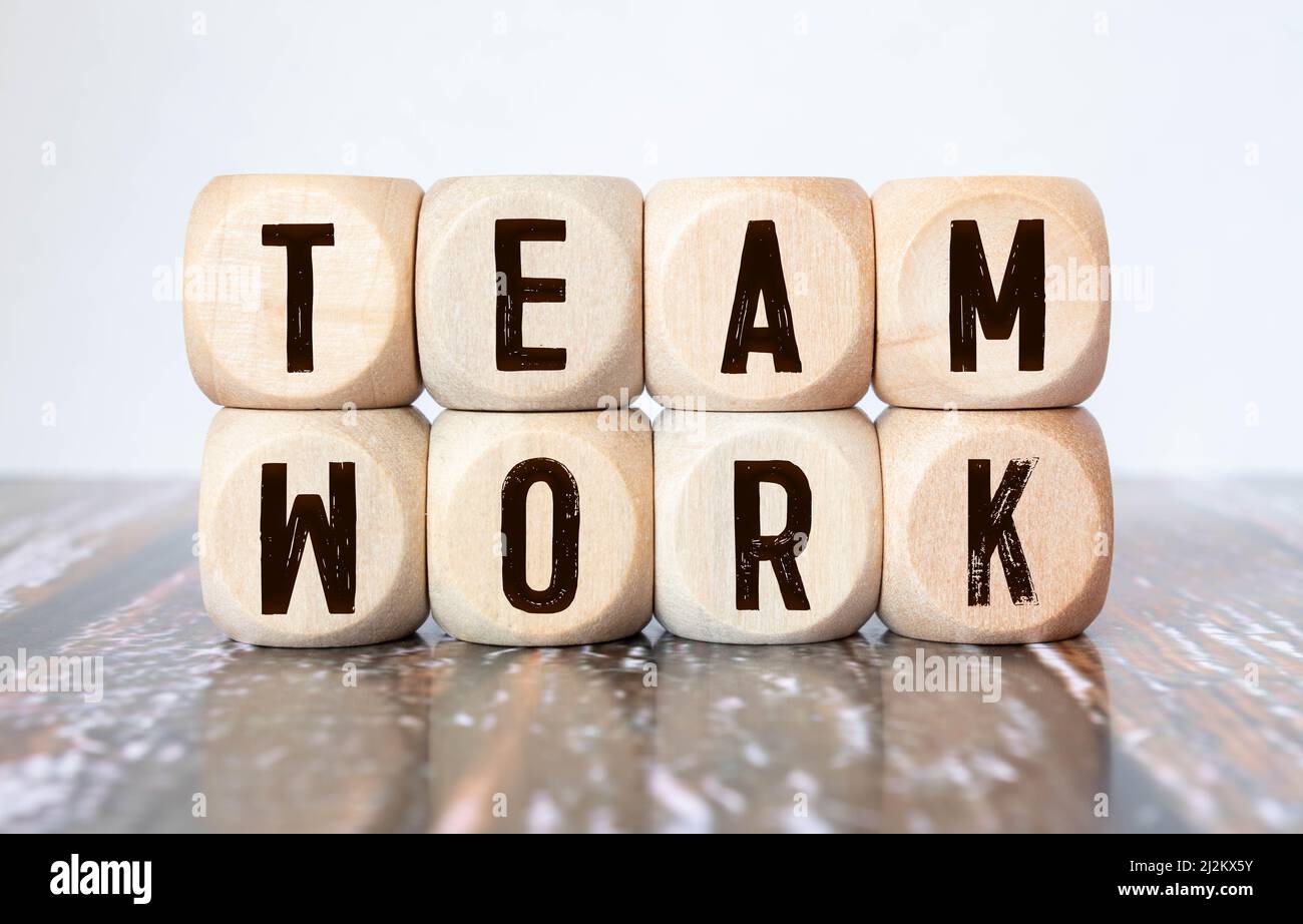 TEAMWORK word written on wood block. concept Stock Photo - Alamy