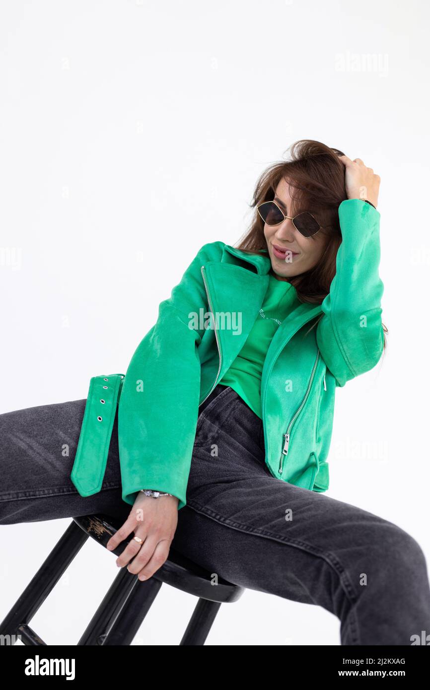 Portrait from below of beautiful lady in casual clothes with sunglasses ...