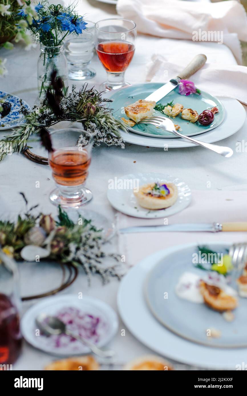 A decorated table for lunch outdoors Stock Photo - Alamy