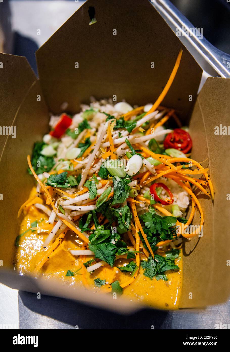 A dish with fresh vegetables in a delivery box Stock Photo - Alamy