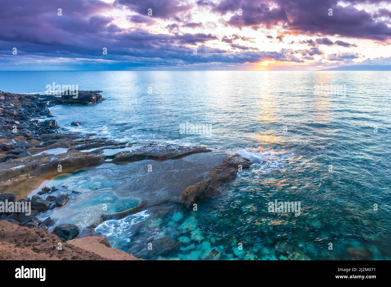 Beautiful sunset on Tenerife canary island coast with rocks and ...