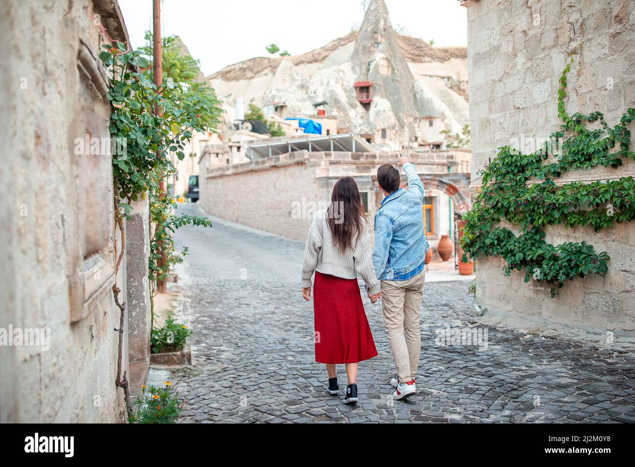 Happy couple on vacation in Europe walking in old streets Stock Photo ...