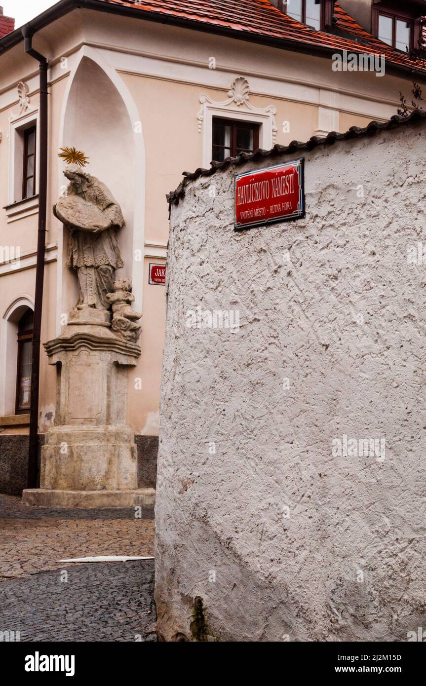 Baroque statue in a corner niche in the medieval city of Kutná Hora ...