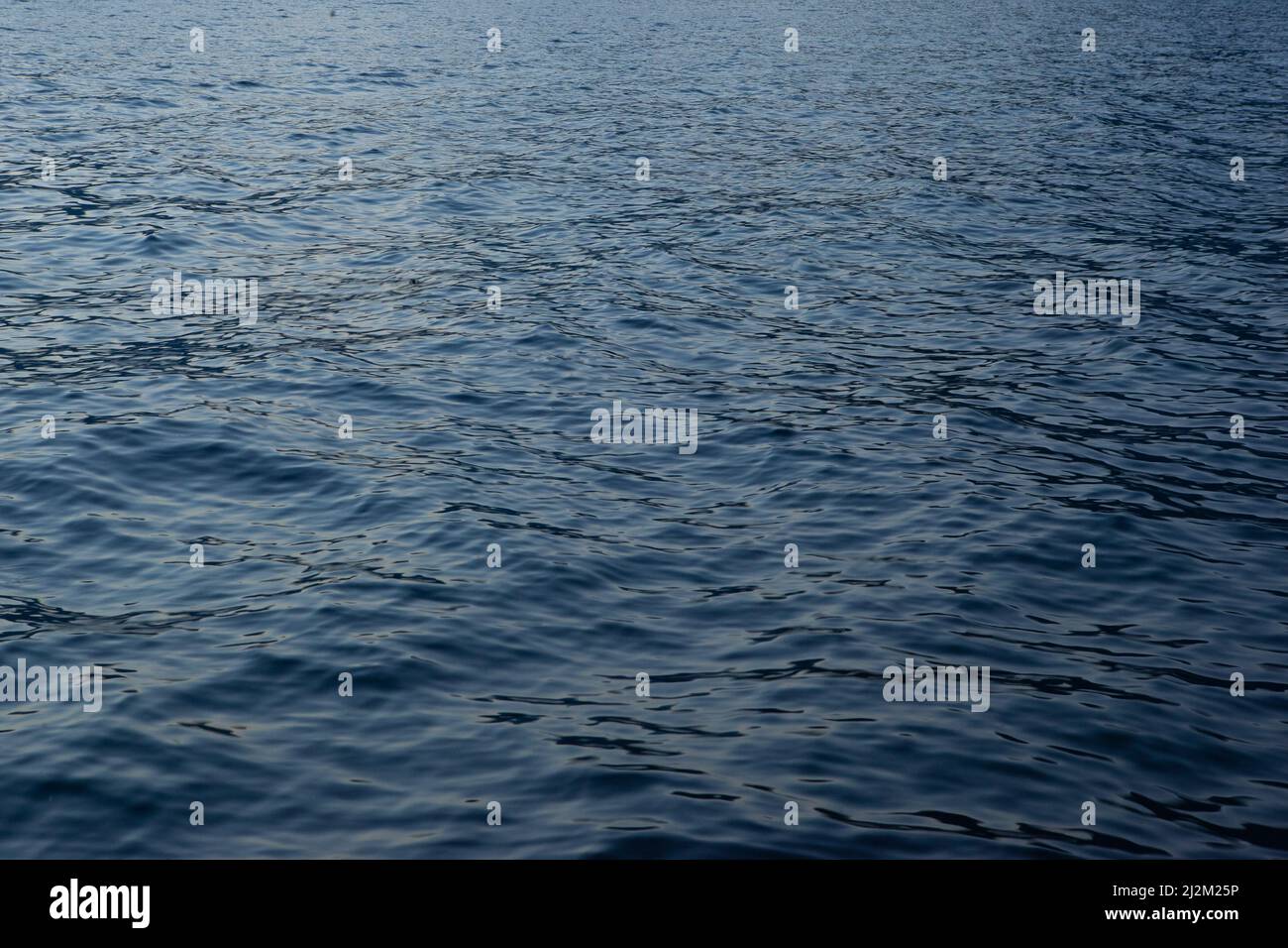 Close-up blue sea background. A backing with sea waves texture for ...