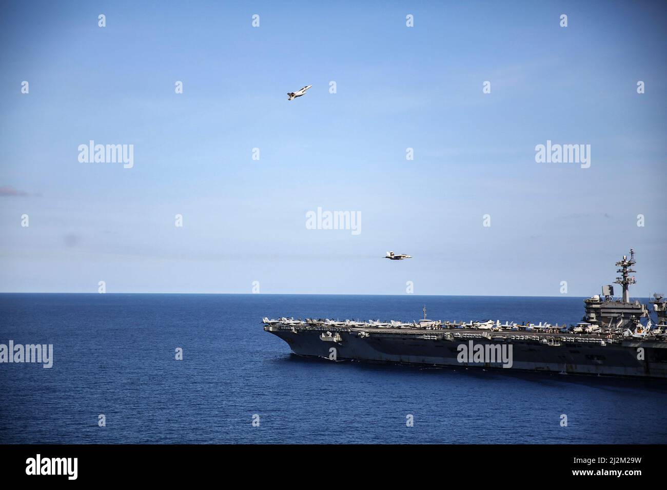 SOUTH CHINA SEA (April 1, 2022) Capt. Michael Langbehn, left, outgoing ...