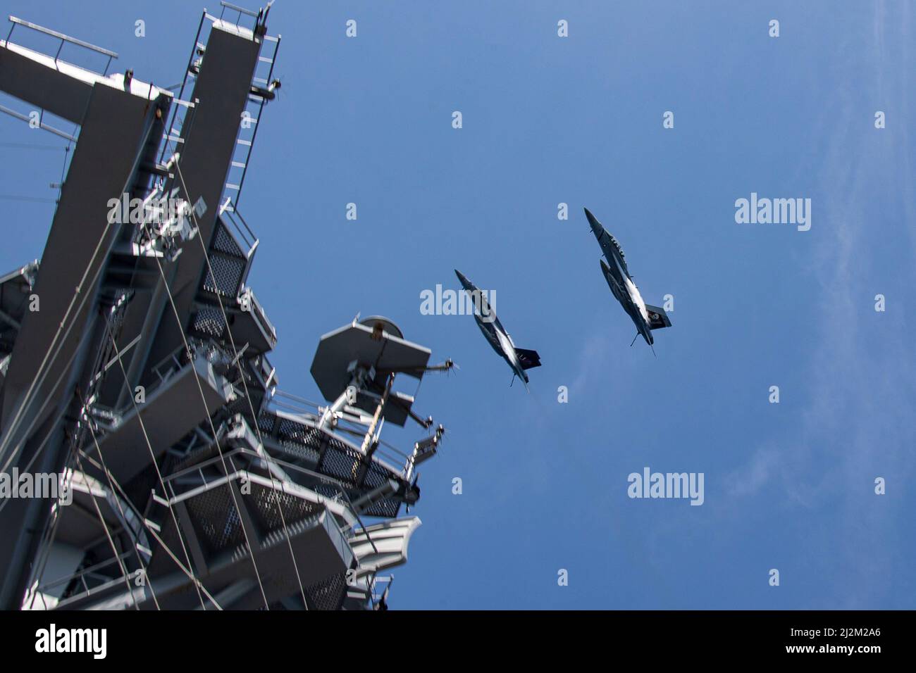 SOUTH CHINA SEA (April 1, 2022) Capt. Michael Langbehn, left, outgoing ...