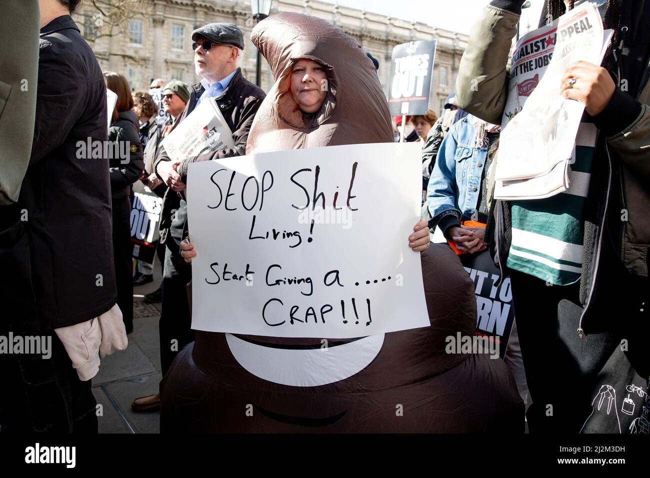 London, UK. 02nd Apr, 2022. A protester dressed in a poo costume holds ...