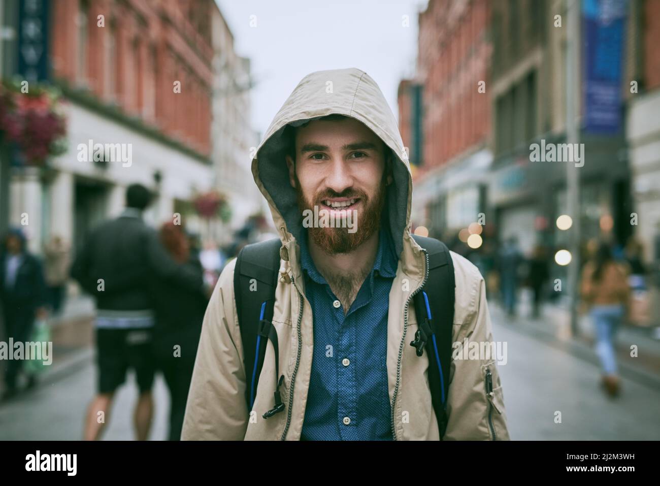Positive young man walking alone hi-res stock photography and images ...