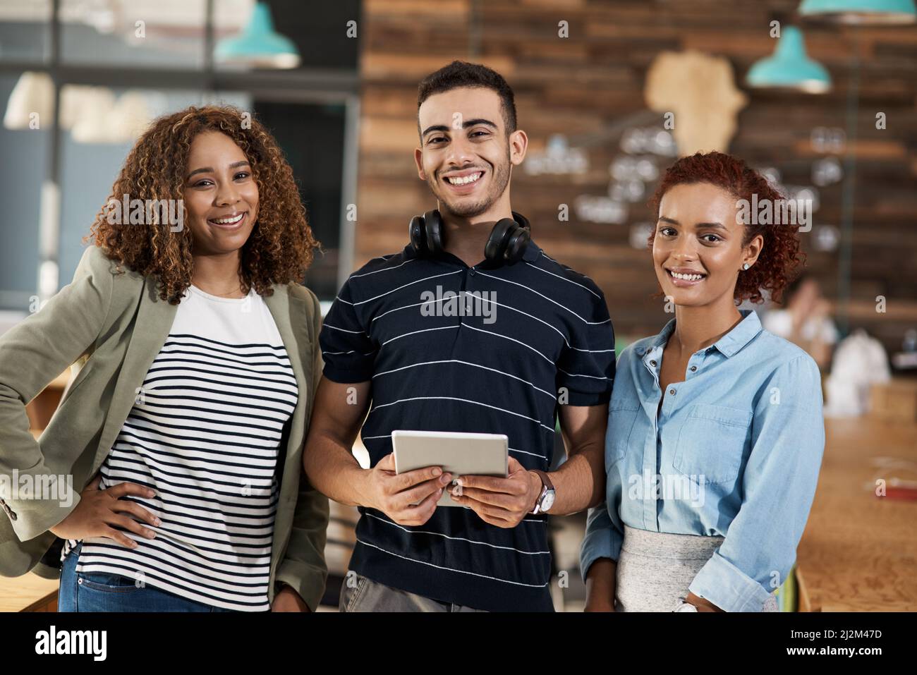 Design is our game. Portrait of a group of young designers working ...