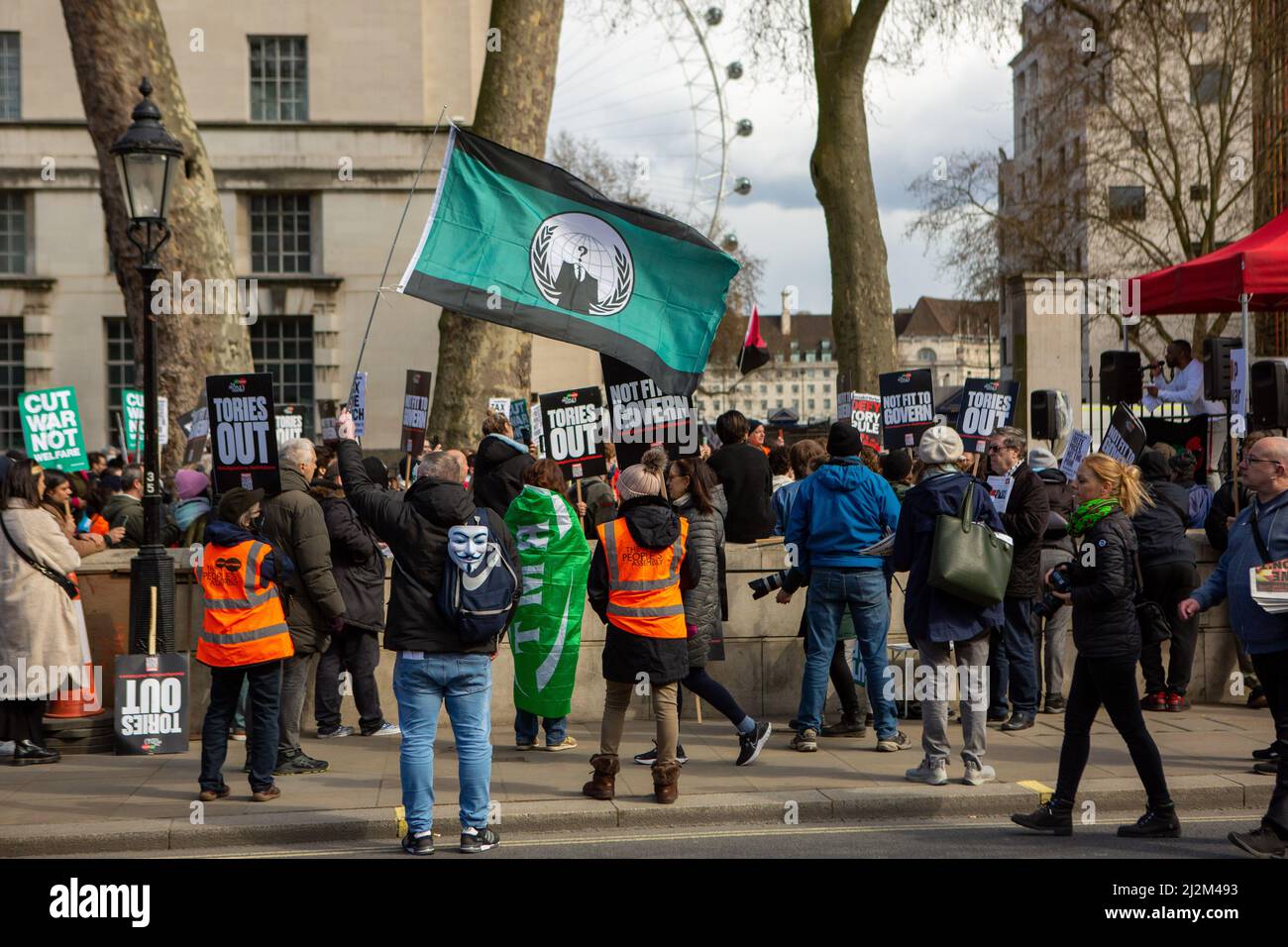 London, UK. 02nd Apr, 2022. A demonstrator waves an 'Anonymous' hacking ...