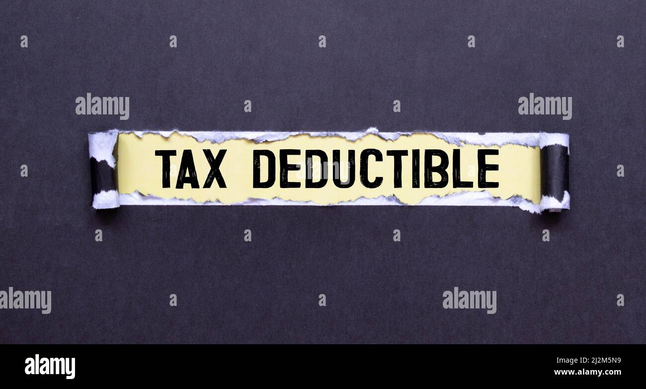 white paper with text Tax Deductions on a yellow background with ...