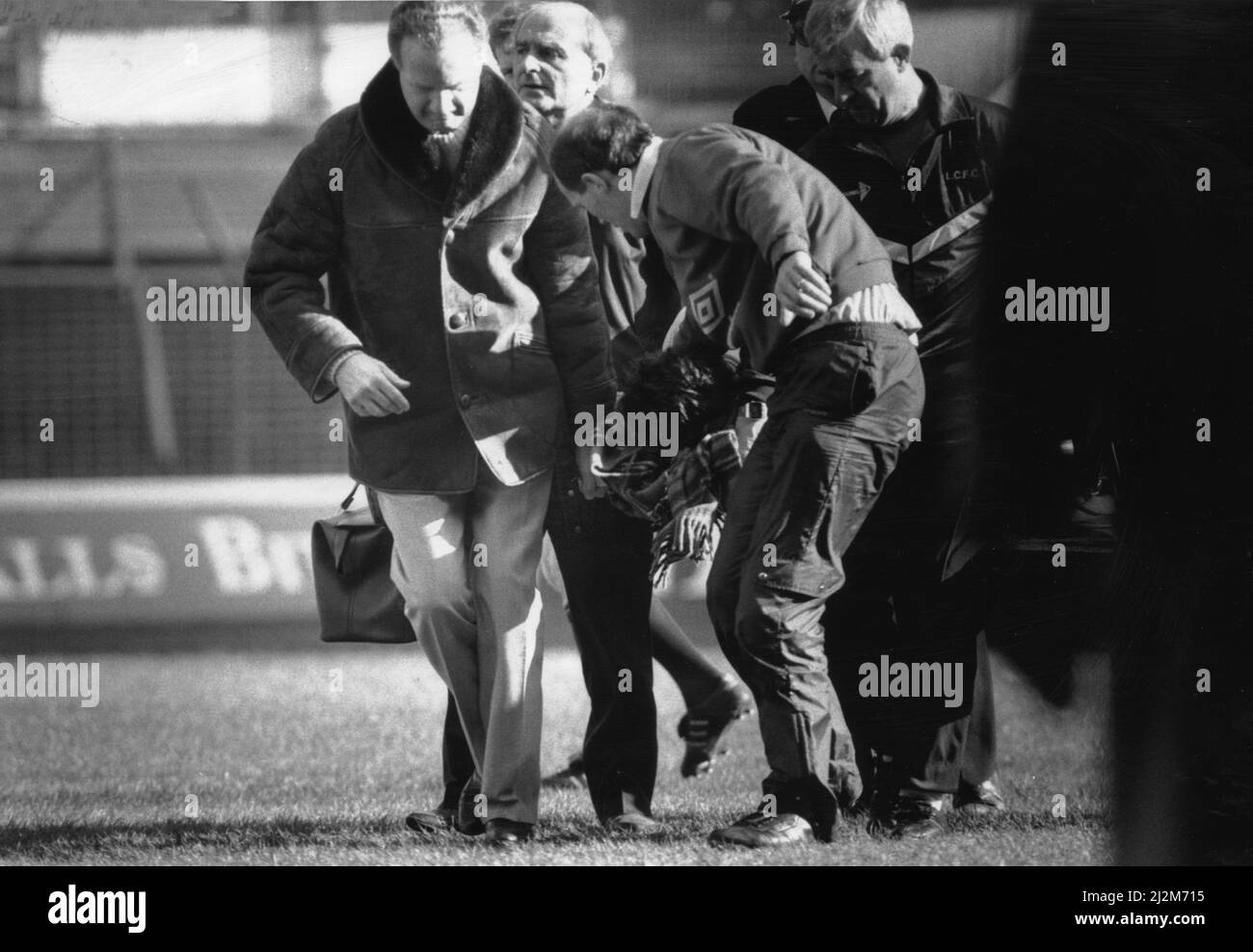 Manchester City player Paul Lake is stretchered off after being knocked ...