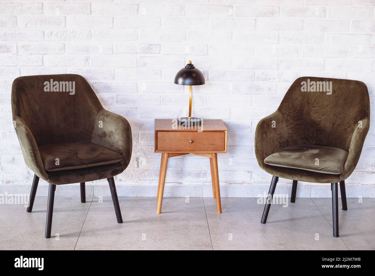 two grey armchairs modern home interior design Stock Photo - Alamy